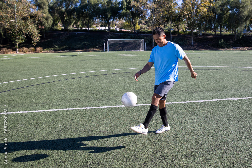 Soccer players work together as a team playing the game together. The ...