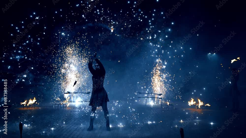Fantastic fire show performed by the female artist. Woman moves the ...