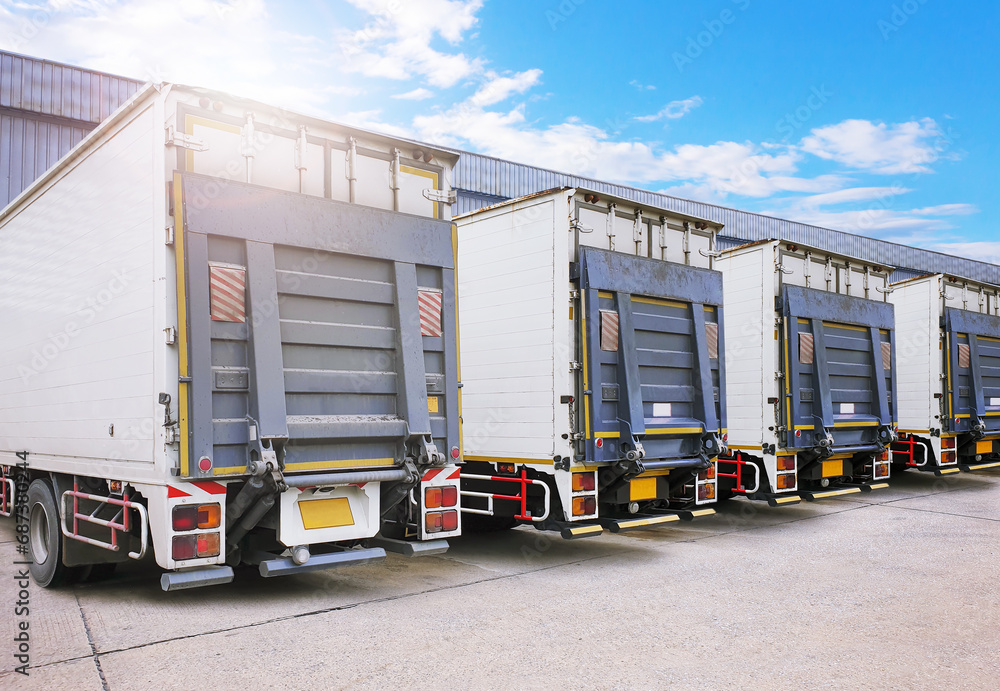 Container Trucks on The Parking Lot at Warehouse. Lifting Ramp Trucks ...