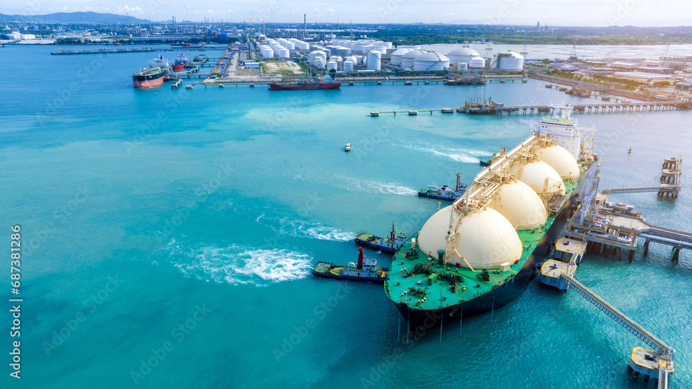 LNG (Liquefied natural gas) tanker anchored in Gas terminal gas tanks ...