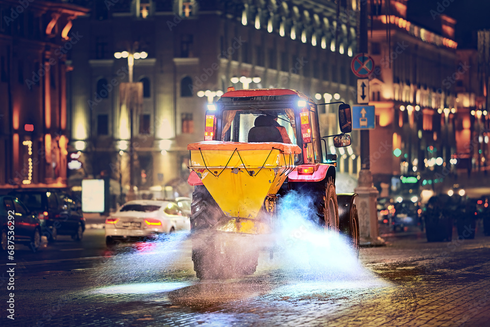 Tractor with salt spreader plow snow, spread salt on pavement after ...