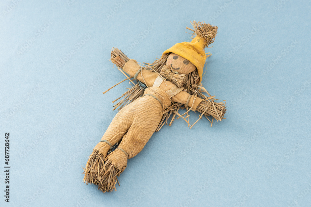 Vintage straw doll.The old way of weaving toys from reeds. An ancient ...