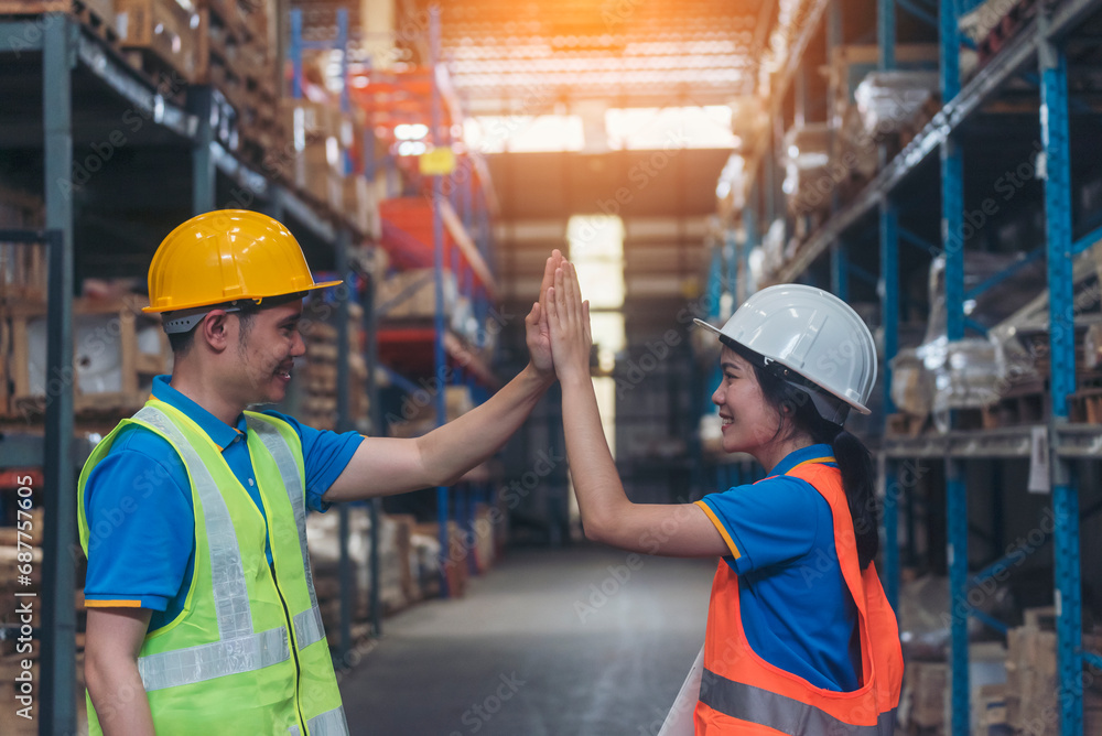 Engineer Teamwork Warehouse worker high five together. Engineer man ...