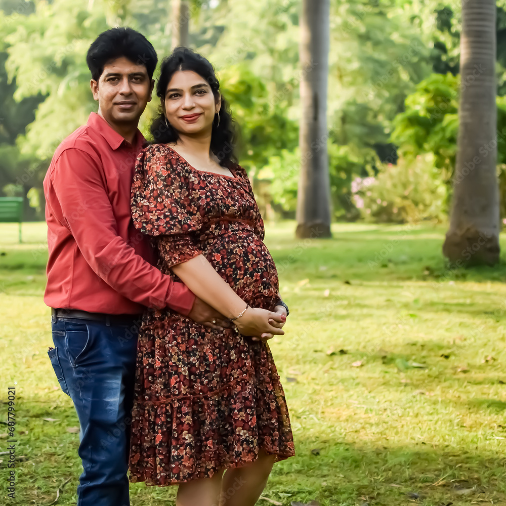 Indian couple posing for Maternity shoot pose for welcoming new born ...