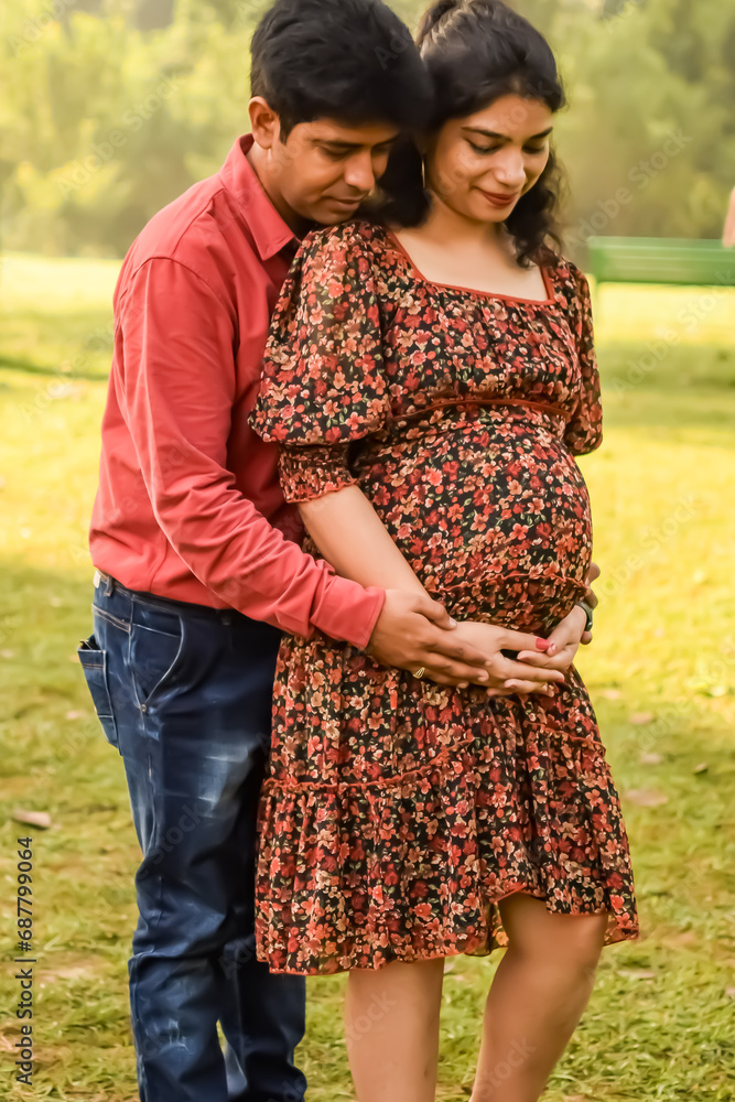 Indian couple posing for Maternity shoot pose for welcoming new born ...