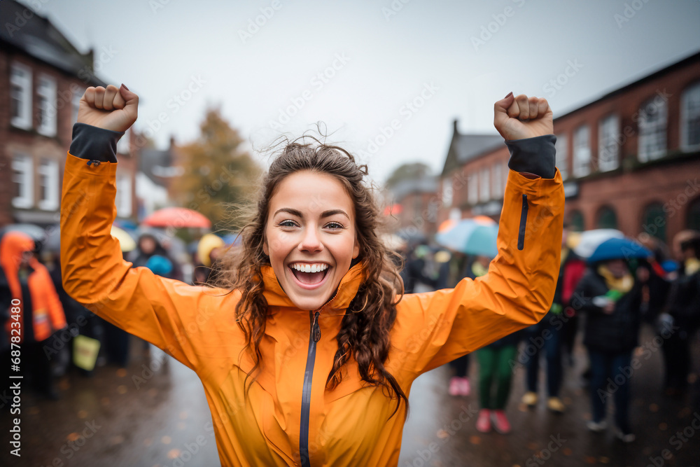 Shot of a female runner on the finish line of a relay race.Young girl ...