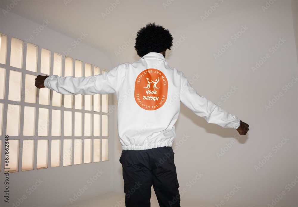 Mockup of man wearing customizable jacket with arms out, camera flash ...
