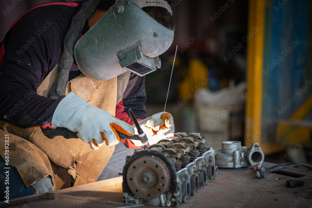 Welder is welding Tungsten Inert Gas welding, Welding aluminum with ...