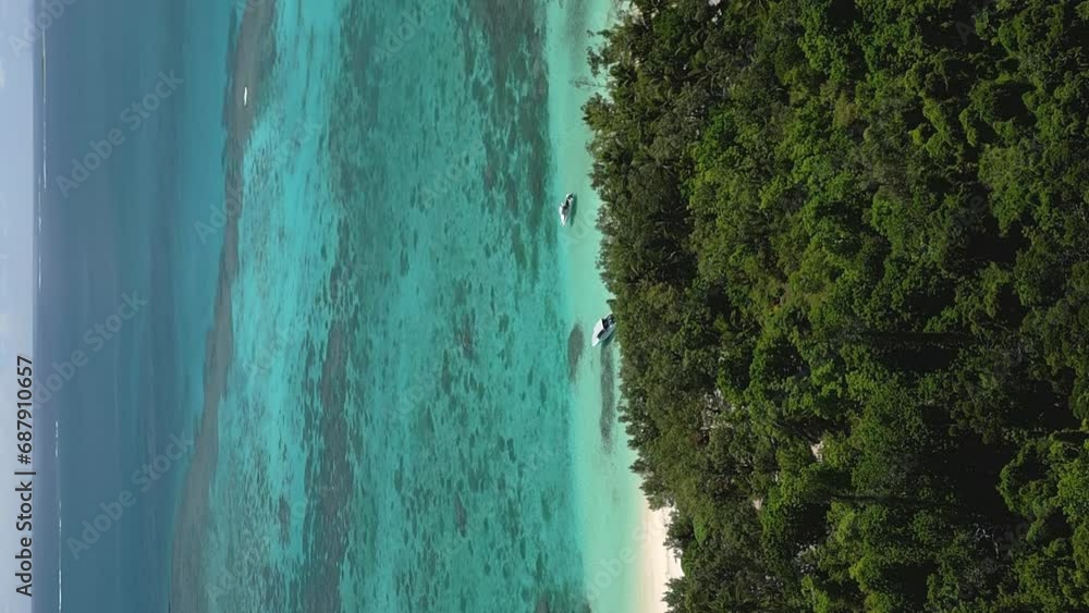 Boats bring tourists to enjoy the beach and a fish fry on iIot Moro ...