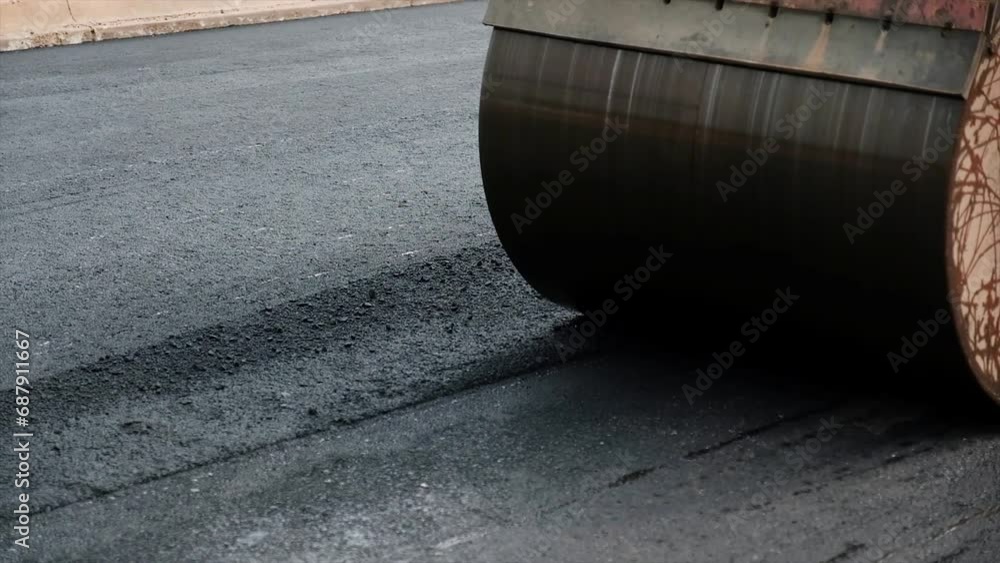 Process of asphalting road construction infrastructure by compressing ...