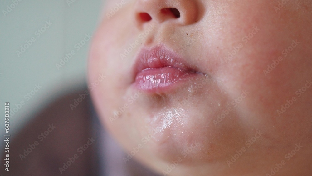 close-up of baby dirty lips. happy family a kid dream concept. close-up baby lips in the kitchen ...