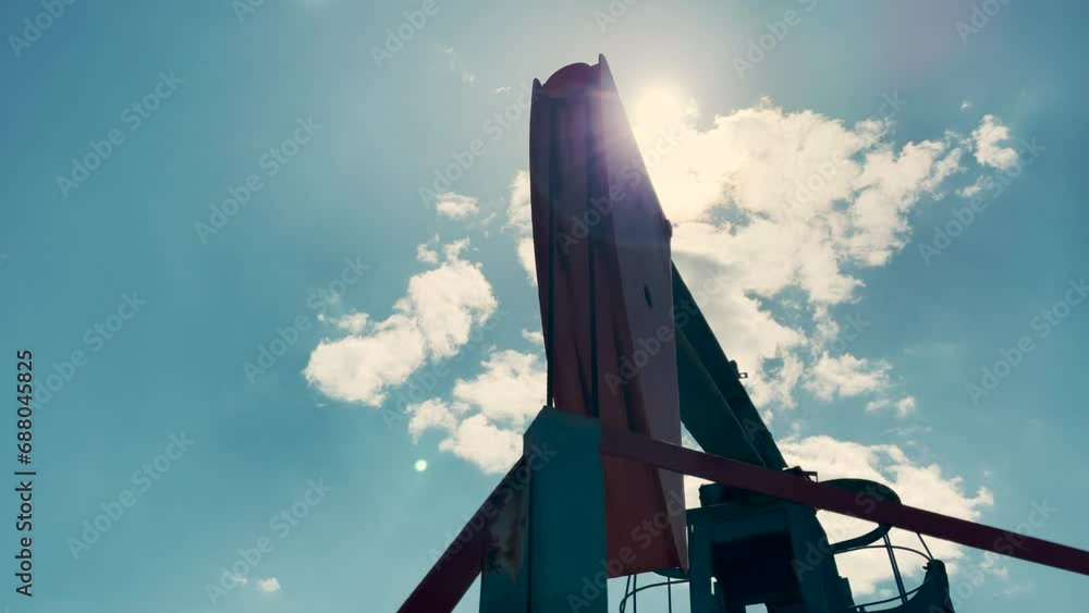 oil production a business. silhouette of an oil and gas drilling rig in ...