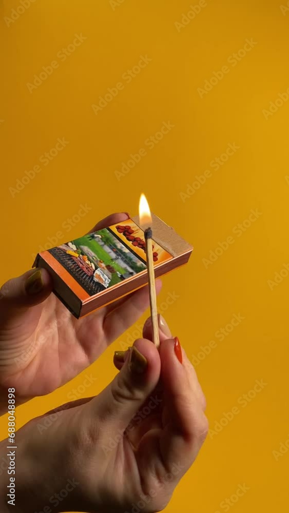 Igniting fire with matches. Fire danger risk concept. Female hands ...
