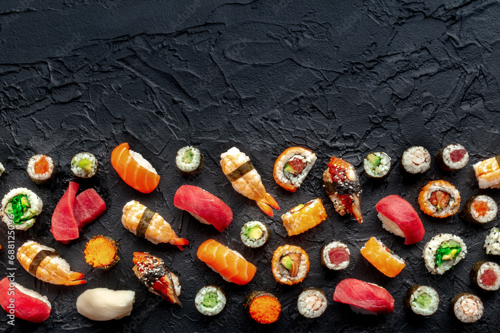 Sushi with copy space. A variety of rolls, maki, nigiri etc, overhead ...