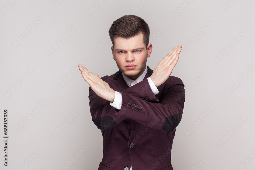 No way, absolutely not. Portrait of handsome man showing x sign with ...