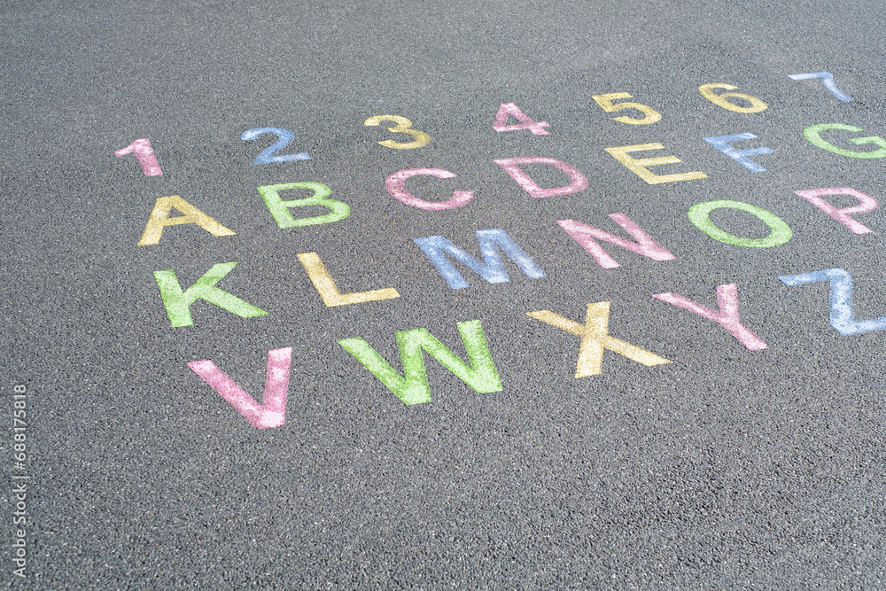 the alphabet and numbers are drawn with color paint on a children's ...