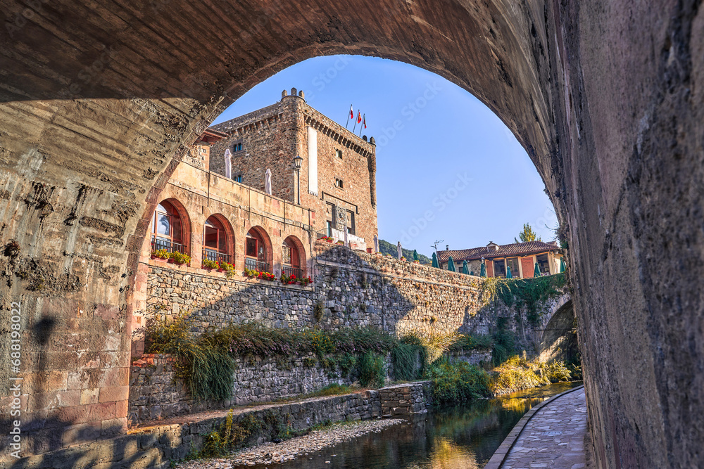 Potes town with Deva river in its path and Torre del Infantado in the ...