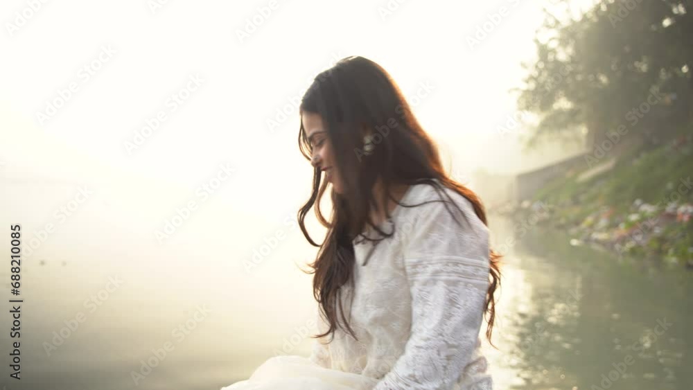 A beautiful Indian girl, wearing a traditional dress, outdoor nature ...