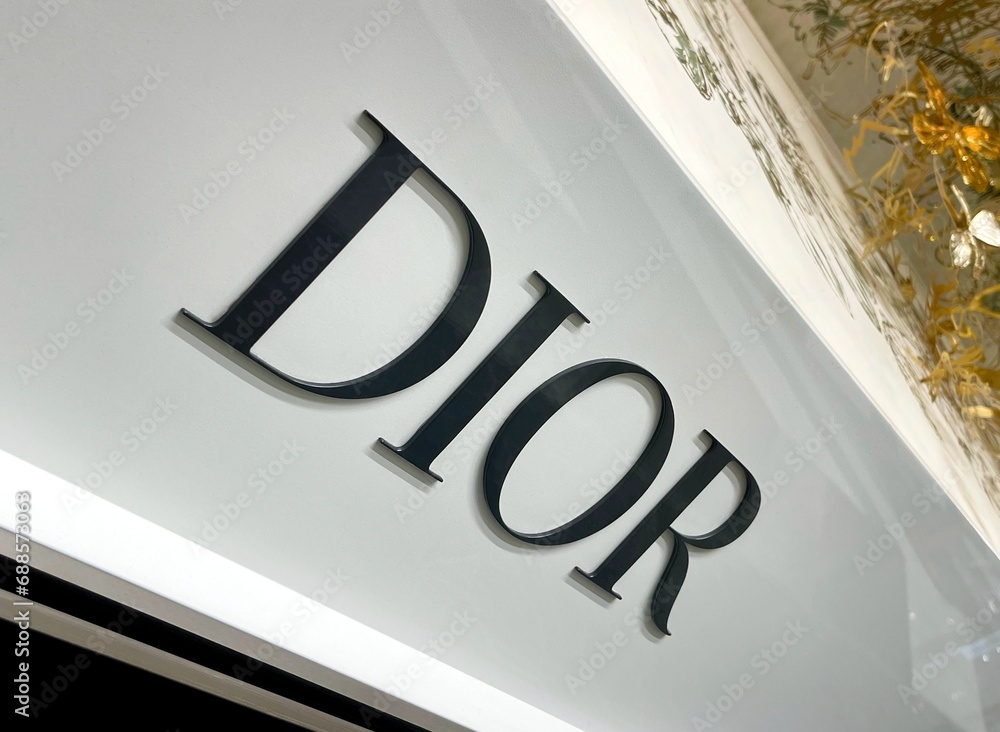 Inscription of Brand Dior close-up view. Large black letters on a white ...