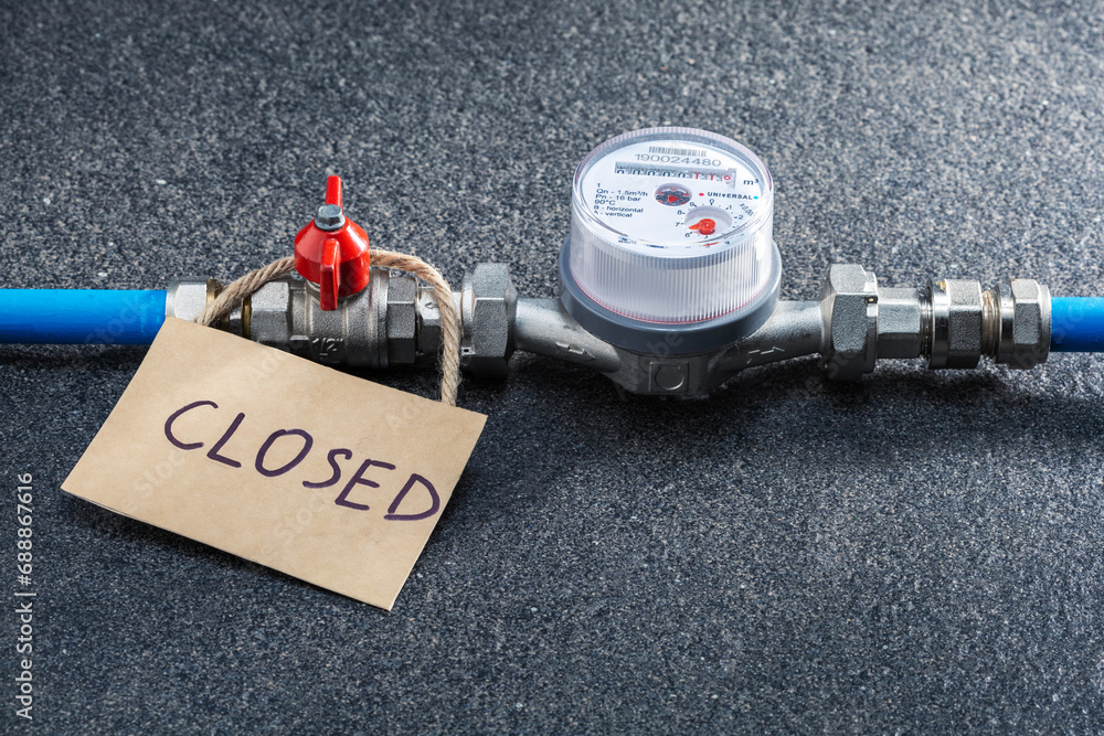 Pipeline water tap on the pipe with sign board closed. disconnecting ...