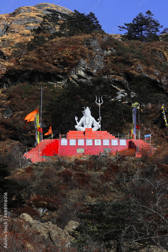 hindu god lord shiva statue on a hill, remote countryside area of high ...