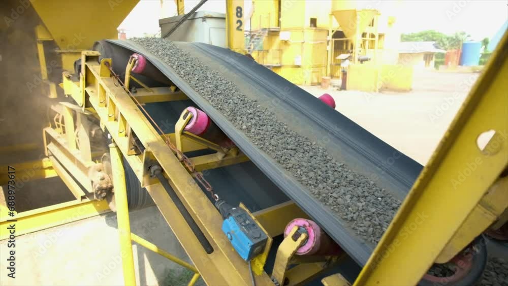 Feeder supplies aggregate from the hot bin to the dryer via a conveyor ...