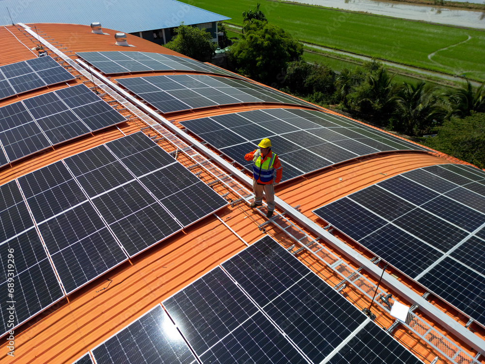 engineer man inspects construction of solar cell panel or photovoltaic ...
