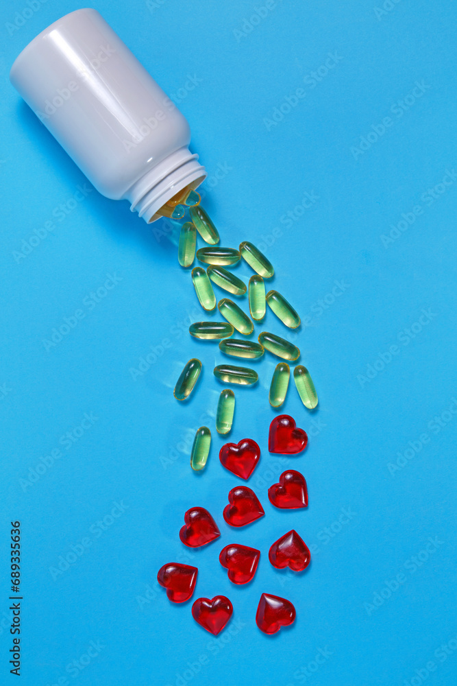 Omega-3 polyunsaturated fatty acids and red hearts pour out from a ...