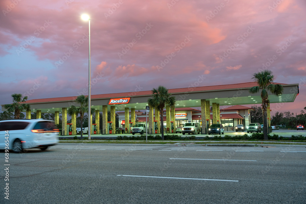 RaceTrac gas station on roadside at night. RaceTrac Petroleum ...