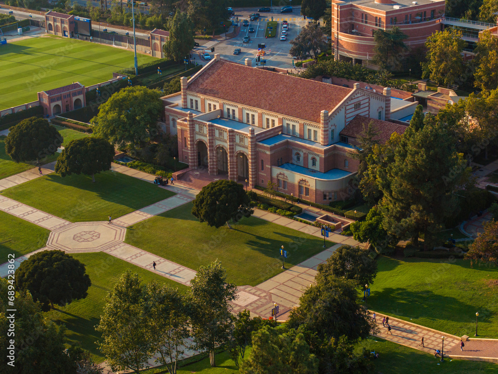 Aerial view of a grand university campus with red-bricked buildings ...
