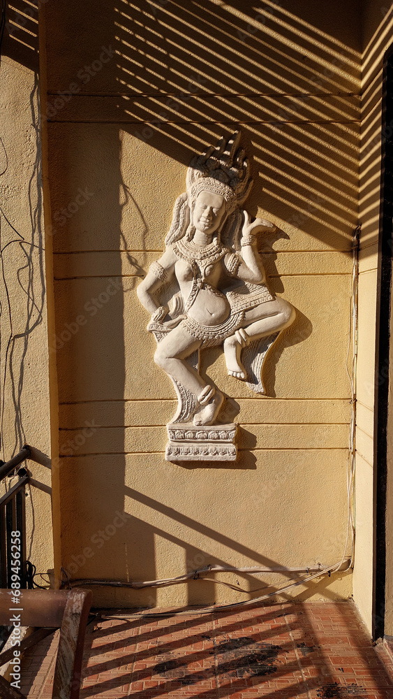 Foto de Elegant bas-relief sculpture of an apsara dancer symbolizing a ...