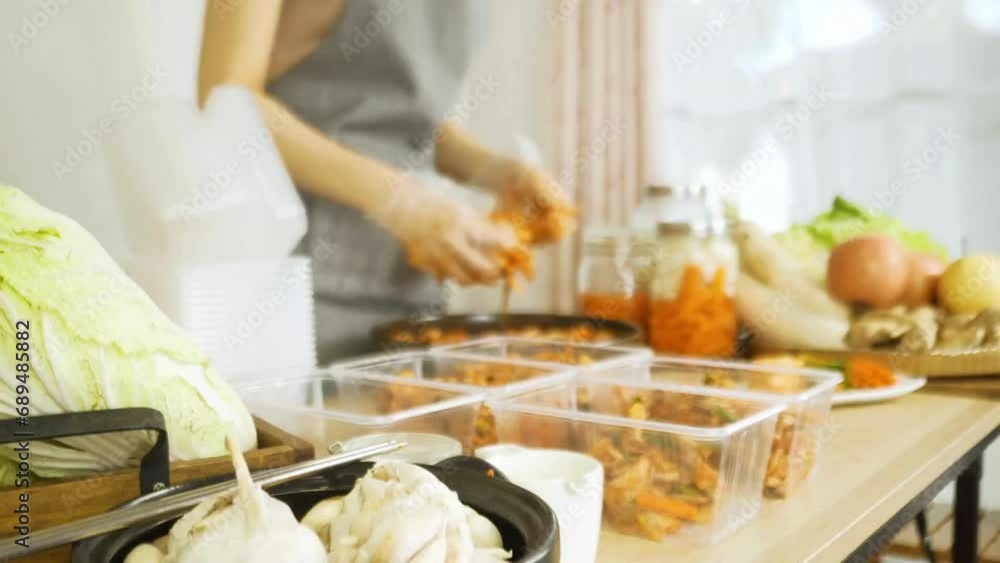 Young woman making fermented kimchi at home. The process of making a ...