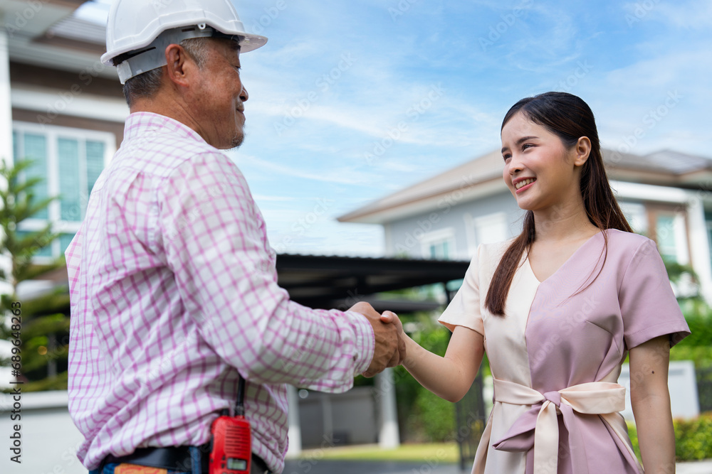 Happy homeowner stand in front of contractor and shake hand, handyman ...