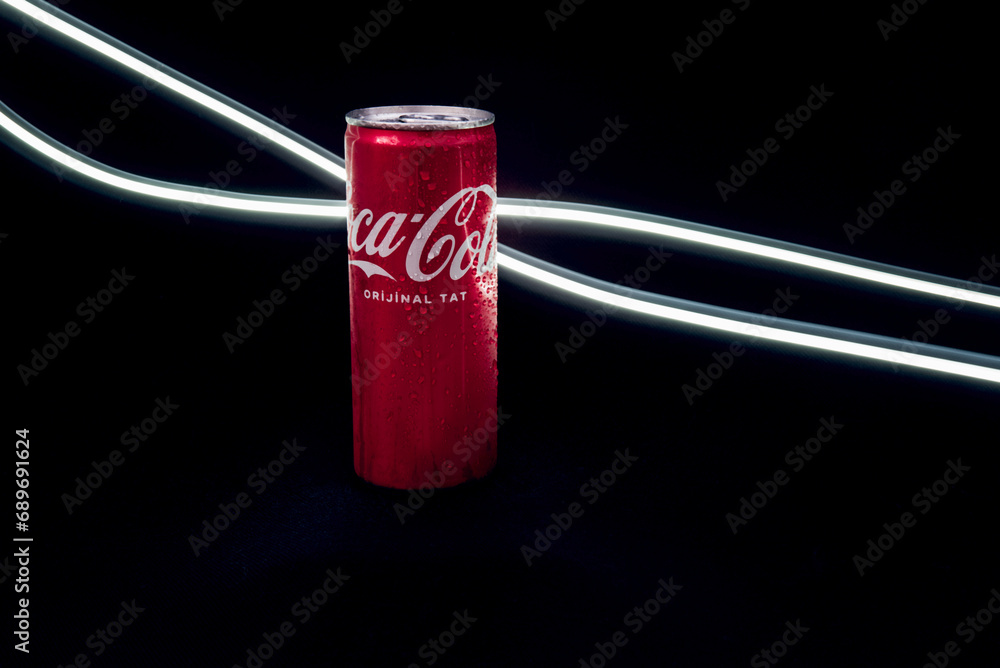 The Coca Cola drink on a black background, details, lighting painting ...