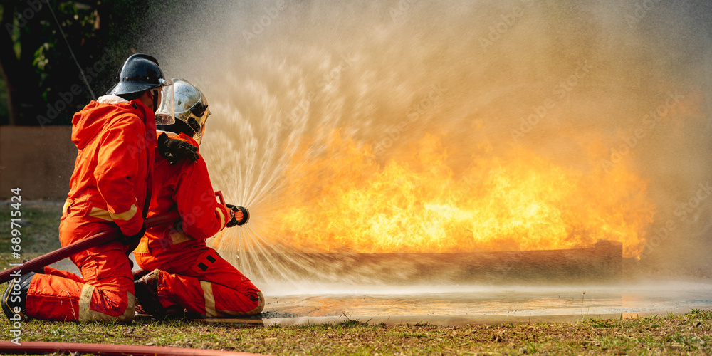 firefighter training fireman team use extinguish spraying fire oil ...
