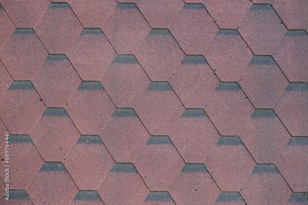 brown roofing asphalt shingles texture background. A close-up of an ...