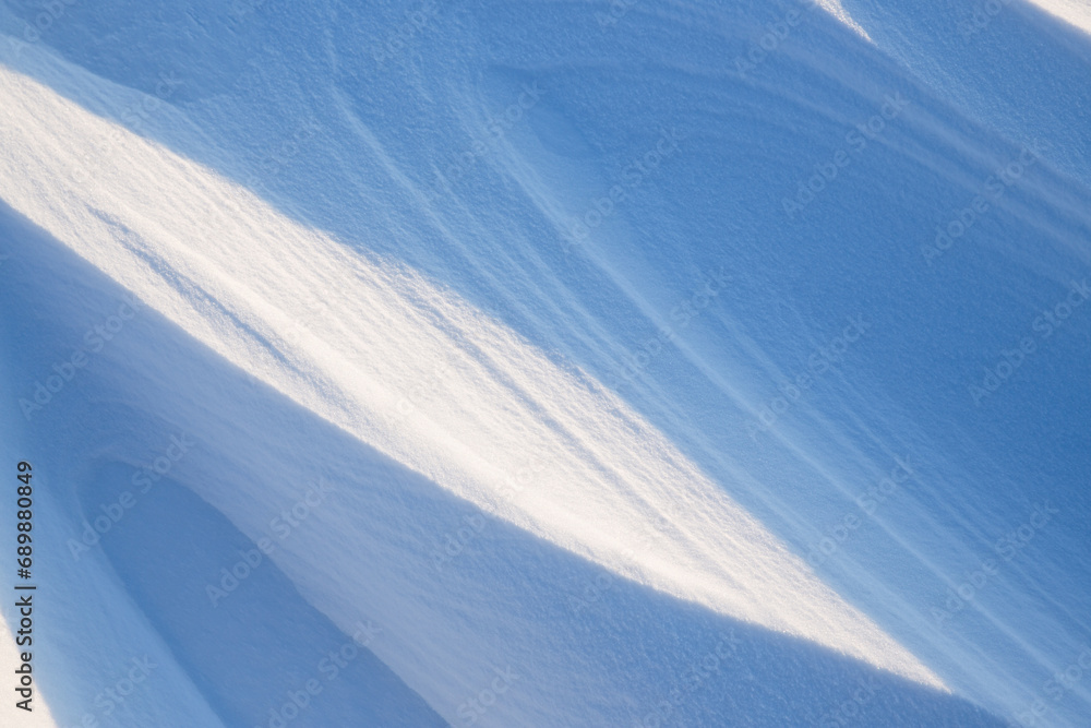 Snow texture. Wind sculpted patterns on snow surface. Wind in the ...