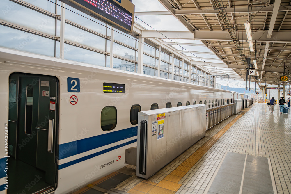A shinkansen bullet rain high speed rail rain with the doors open at ...