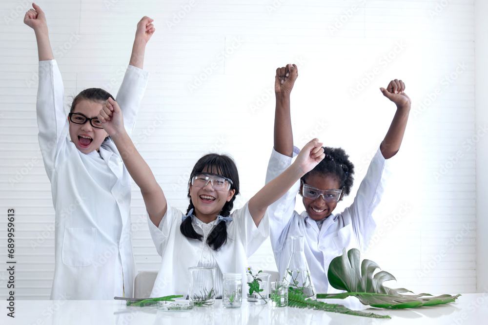 Three friends from various nationalities raised their hands to ...