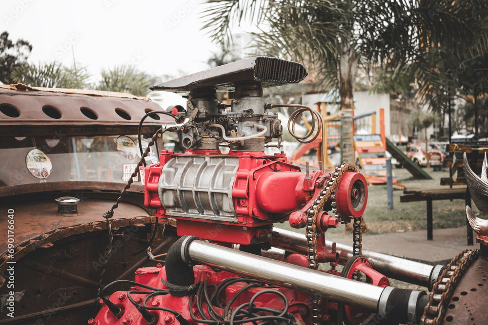Detail of Engine details of an old custom Ford muscle car on display at ...