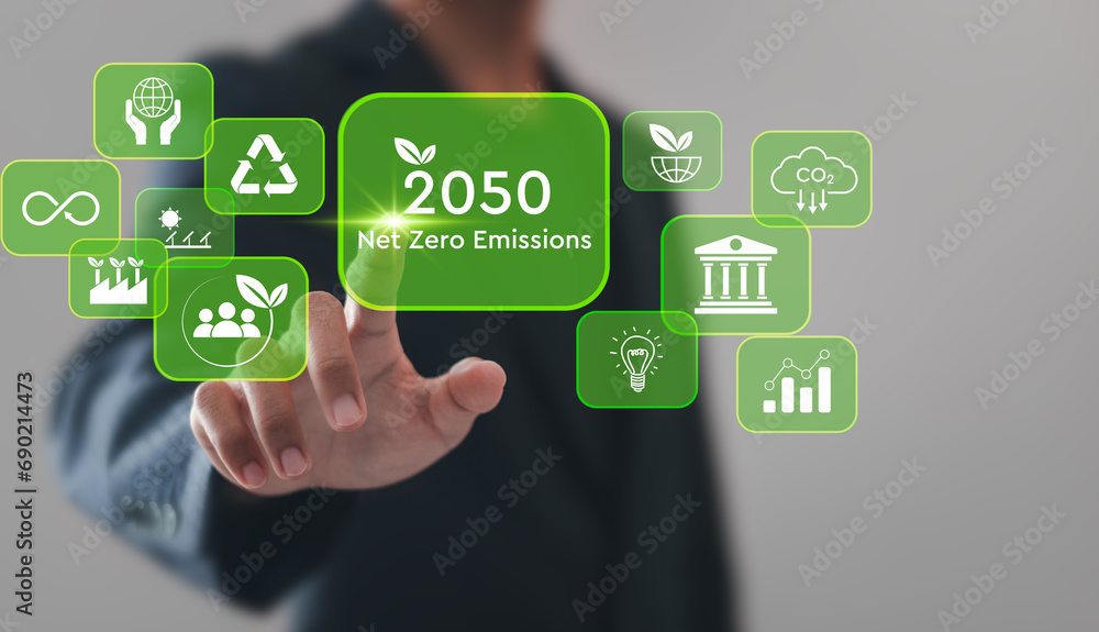 Net zero emissions by 2050. Businessman touching virtual Net Zero icons ...