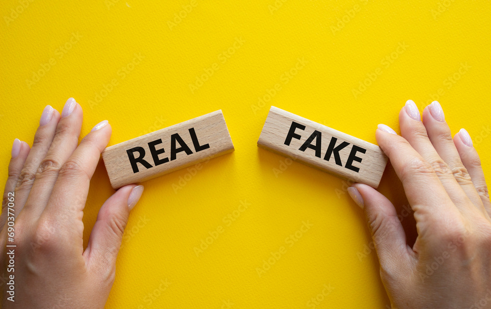 Real or Fake symbol. Concept word Real or Fake on wooden blocks ...