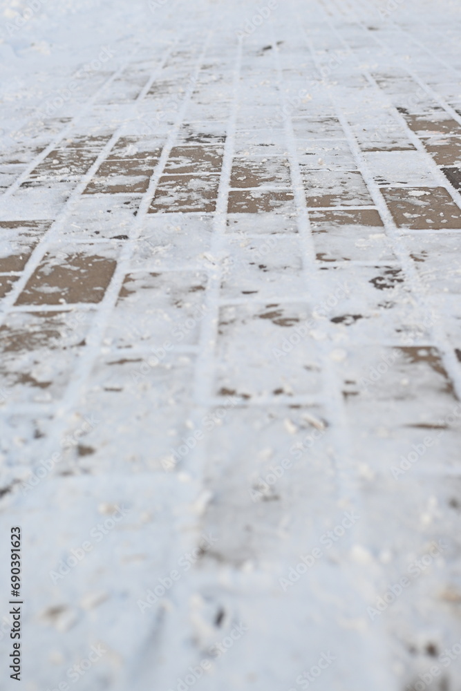 snow-covered asphalt, snow-covered road surface asphalt tile covered ...