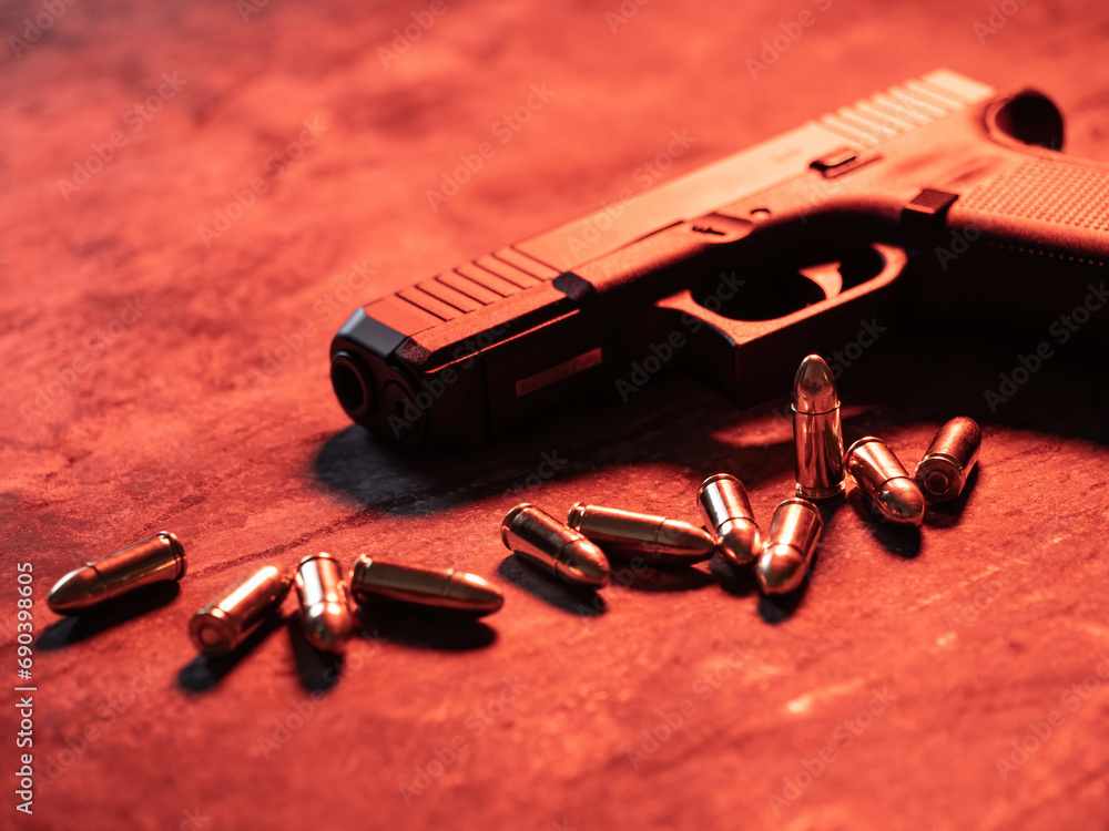 Hand gun with ammunition on dark background. 9 mm pistol military ...