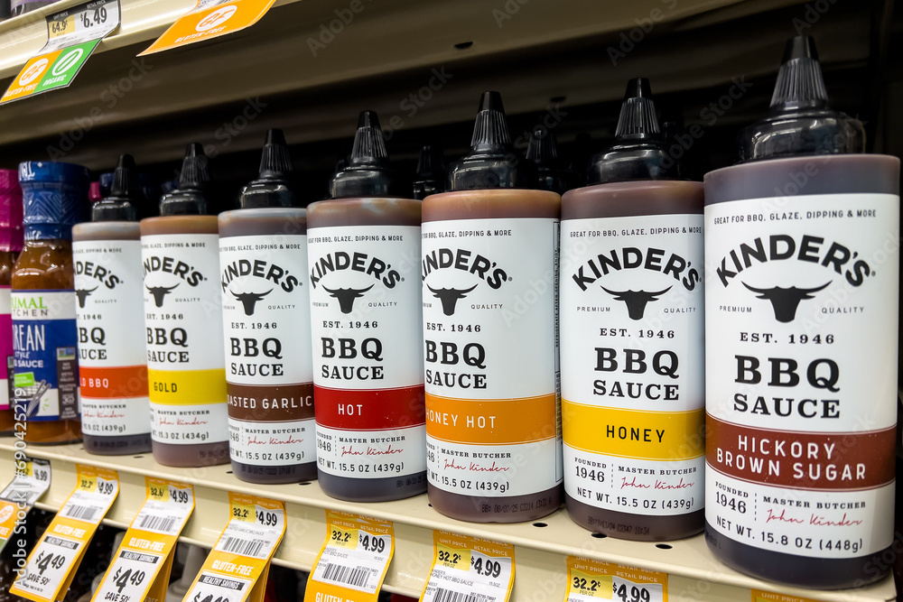 Plastic bottles of Kinder's brand barbecue sauce for sale at a local ...