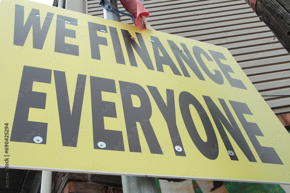 we finance everyone caption writing text sign in black capital letters ...