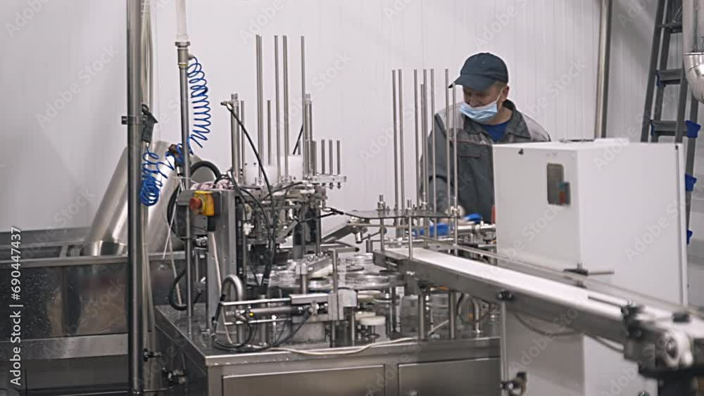 Factory worker deals with the industrial machine maintenance ...