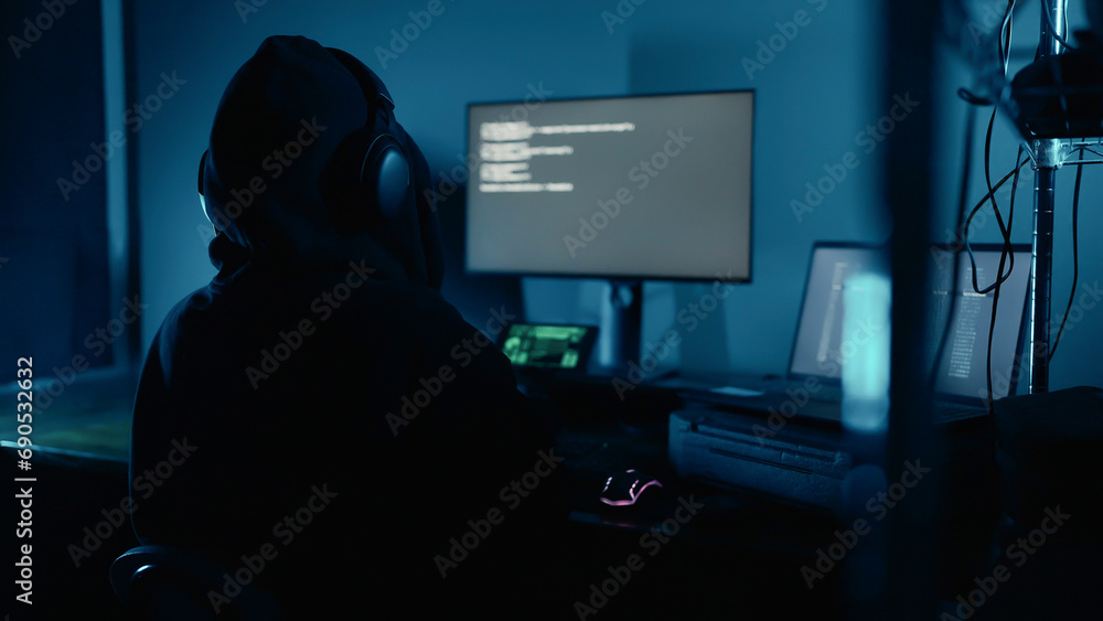 Hacker Working On Laptop At Night In The Modern Workspace Hacker Or