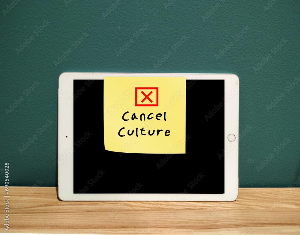 Tablet with stick note written Cancel Culture - refers to mass ...