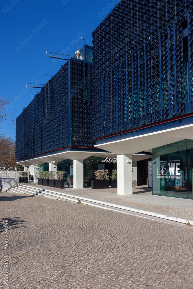 Cascais, Portugal - Feb 5 2023: Edifício Náutico Apartments in a modern residence, with shops on ...
